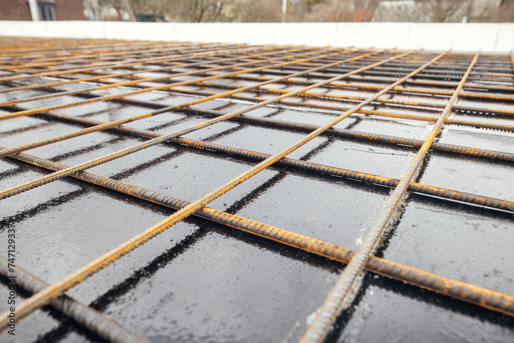 Reinforcement rods at construction site. Steel rebar mesh close up ...