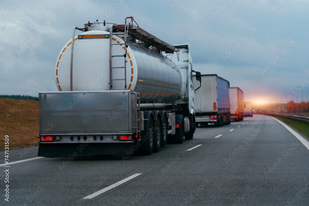 Petrol truck on highway hauling fossil oil refinery products. Fuel ...
