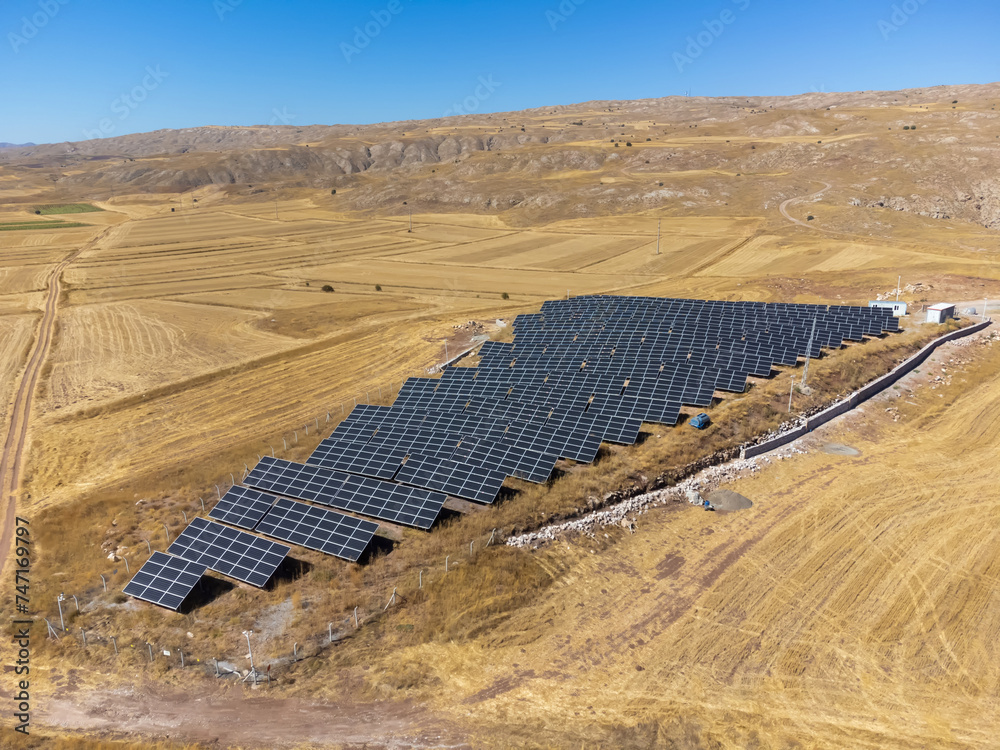 View from the drone on the rows of solar panels. Photovoltaic panels ...