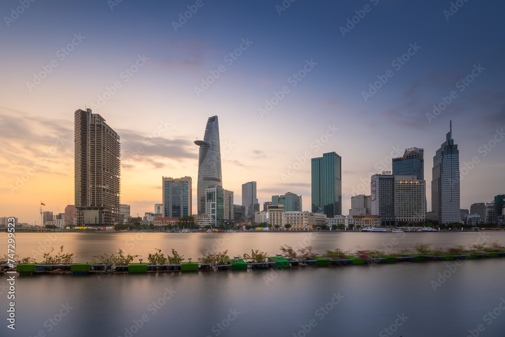 view of Bitexco Tower, buildings, roads and Saigon river in Ho Chi Minh ...