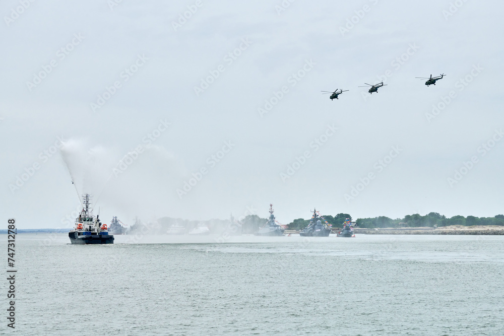 Fireboat sailing along Russian naval forces parade warships with ...