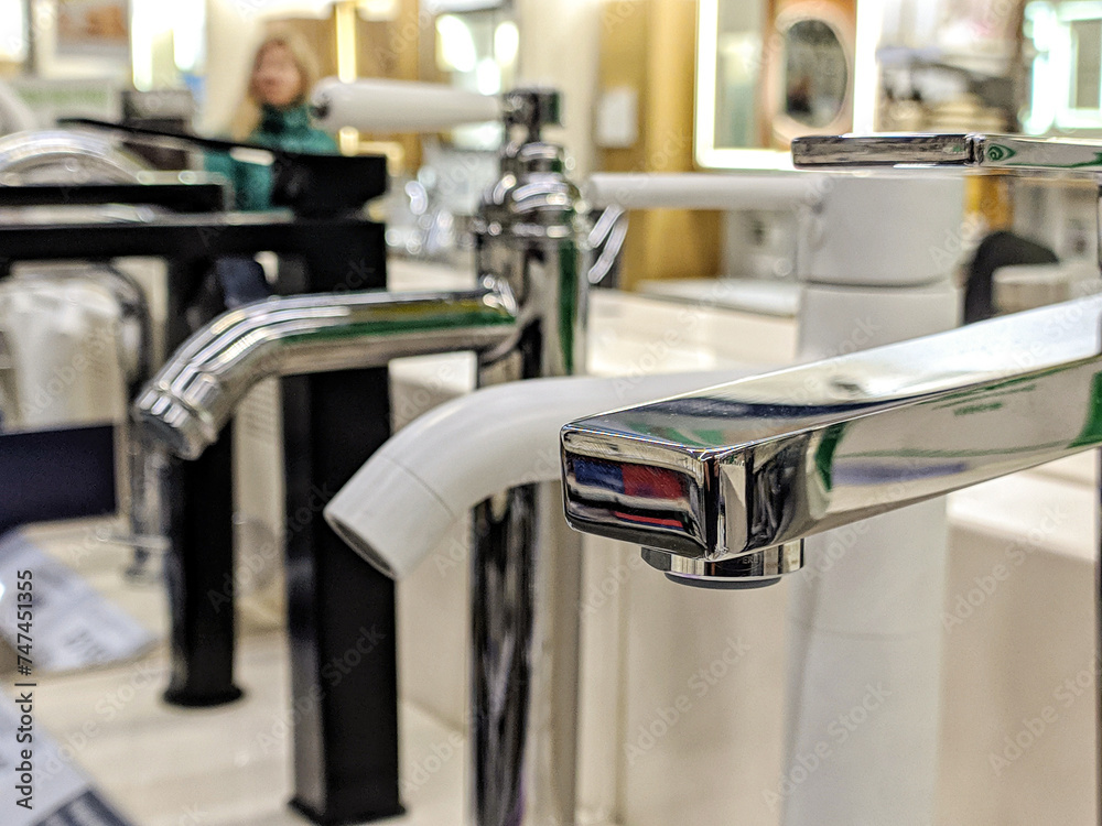 Wide range of new faucets in a shopping center. Modern kitchen and ...