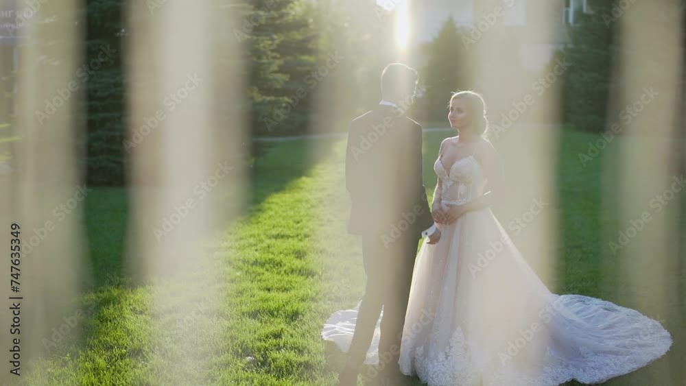 Look over groom's shoulder at happy crying bride. The bride sees the ...