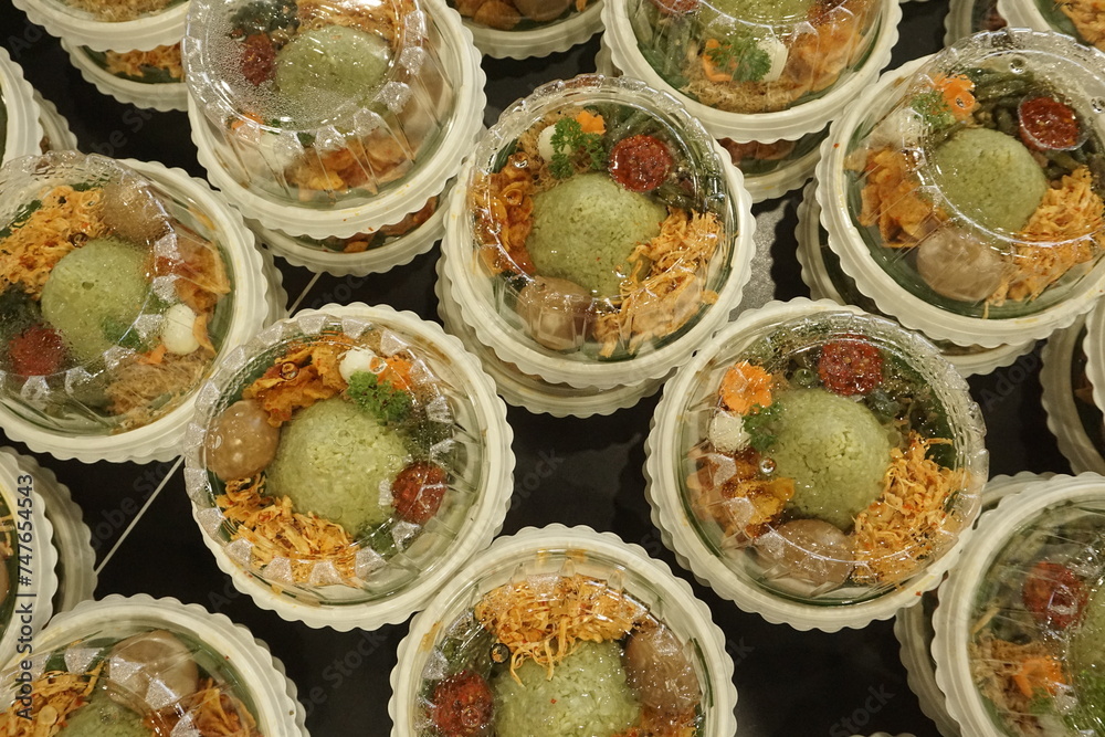 Small cone green shaped rice or Nasi tumpeng hijau mini in Indonesian ...