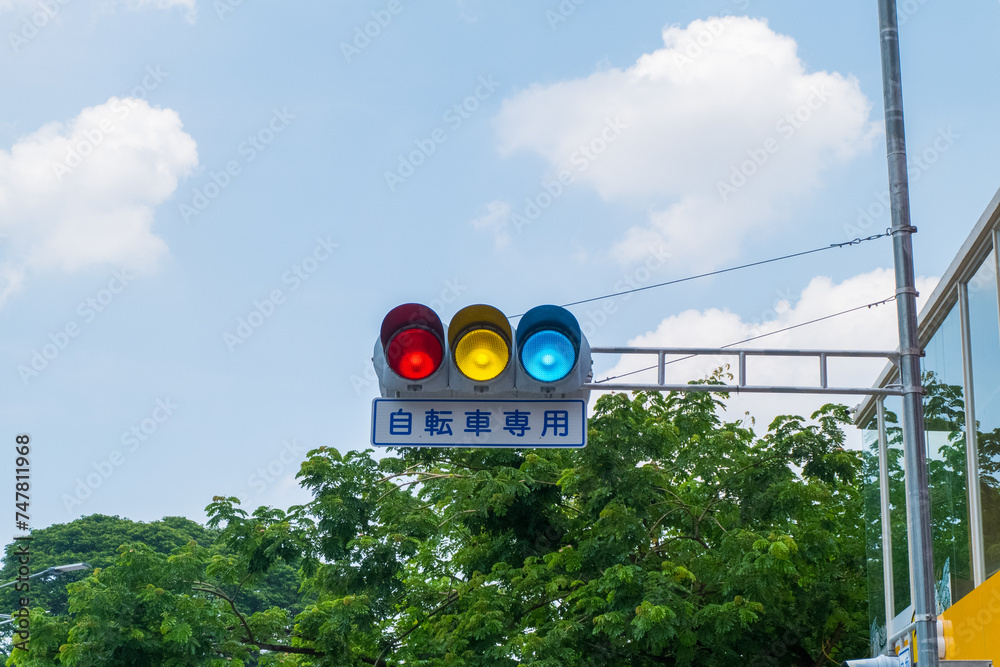 Japanese traffic lights and sign above scramble crossing in front of ...