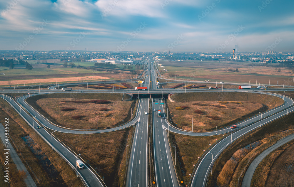 road loops, motorway, expressway with exits in front of the city ...