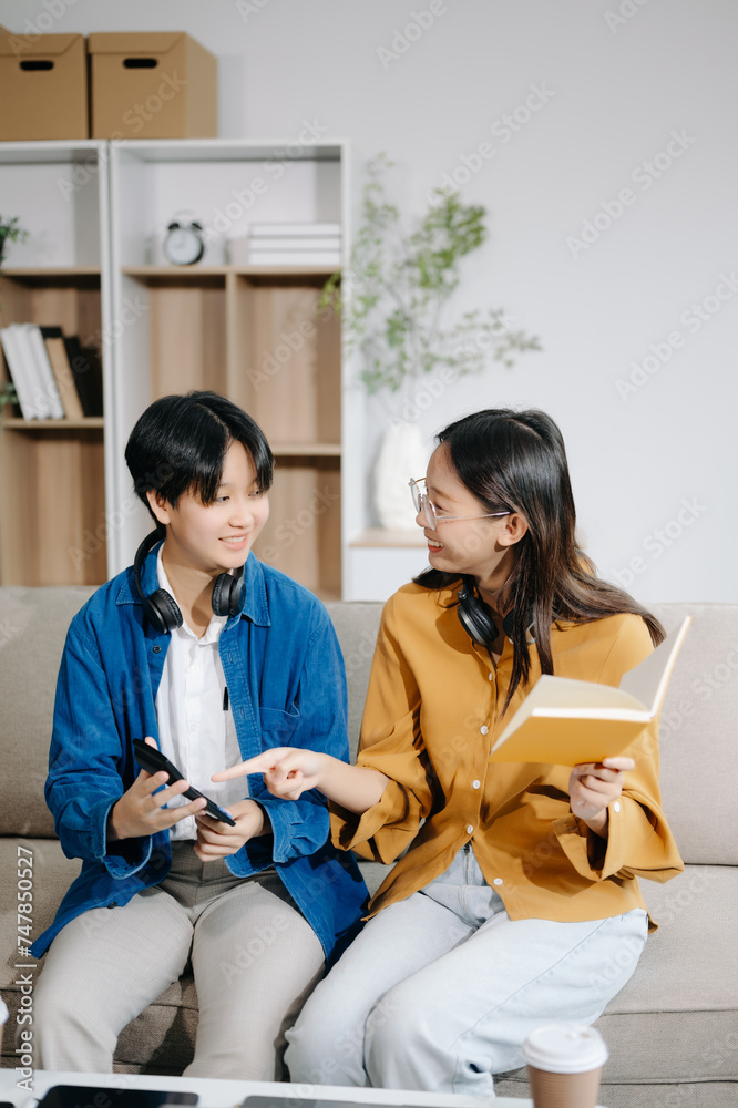 Two Attractive young Asian female college students working on the ...