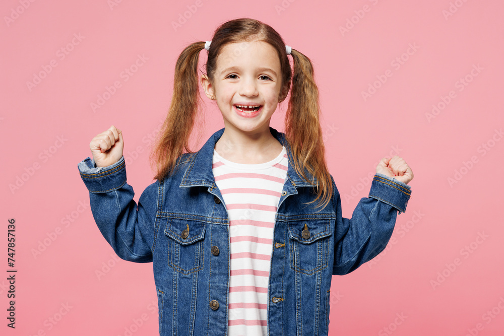 Little child cute kid girl 7-8 years old wears denim shirt have fun do ...