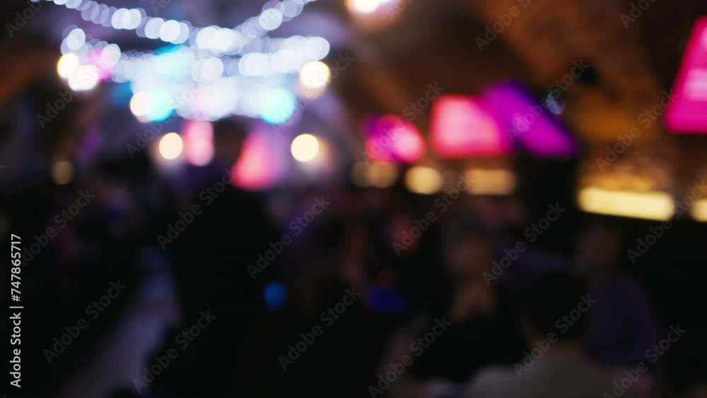 Vidéo Stock Unfocused bar scene with a diverse group of friends ...