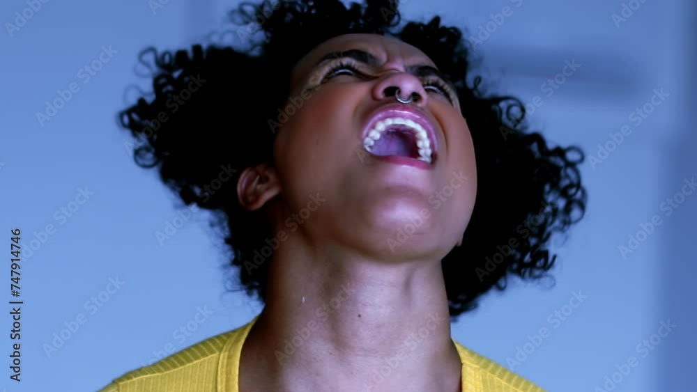 Dramatic moment of young woman yelling in despair at sky feeling anger ...