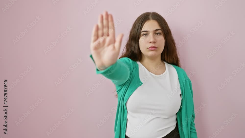 Defiant young hispanic woman firmly gesturing 'no more!' with raised ...