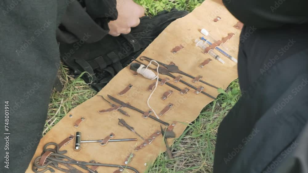 LARP (live action role play) scene: a doctor showing a collection of ...