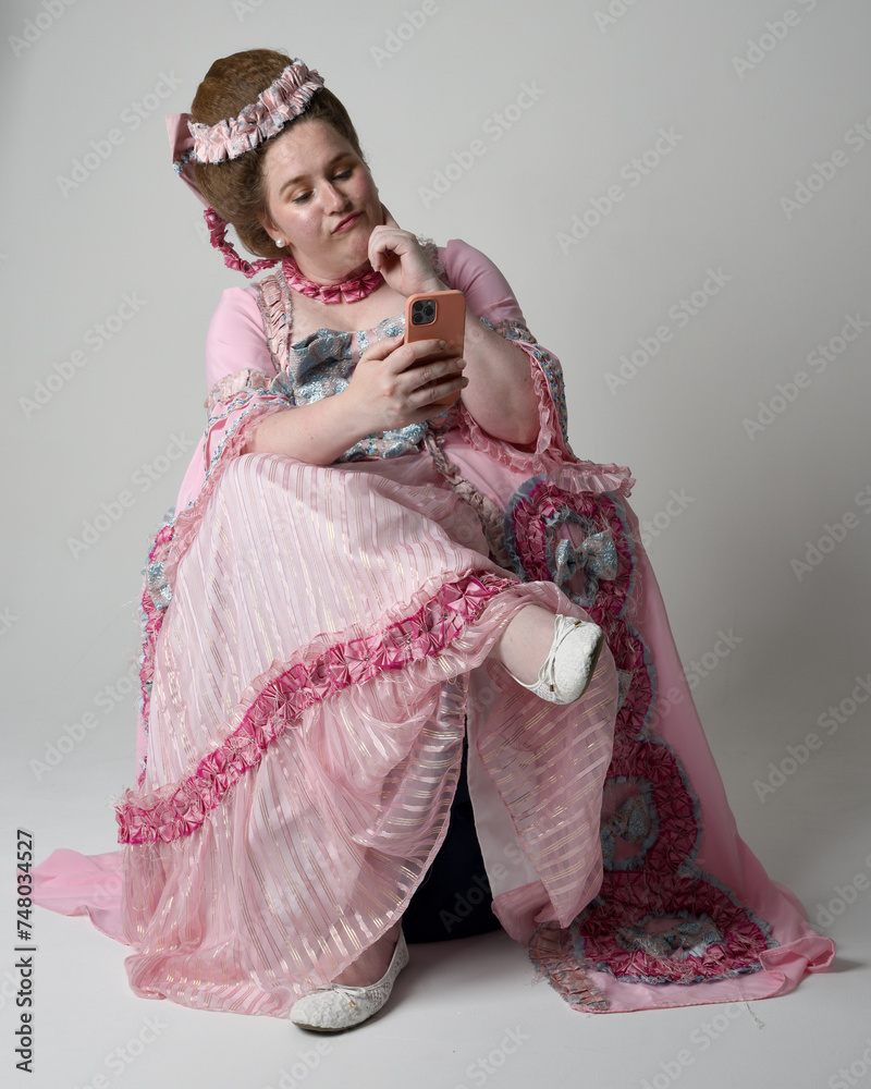 Full length portrait female model wearing opulent pink gown costume of ...
