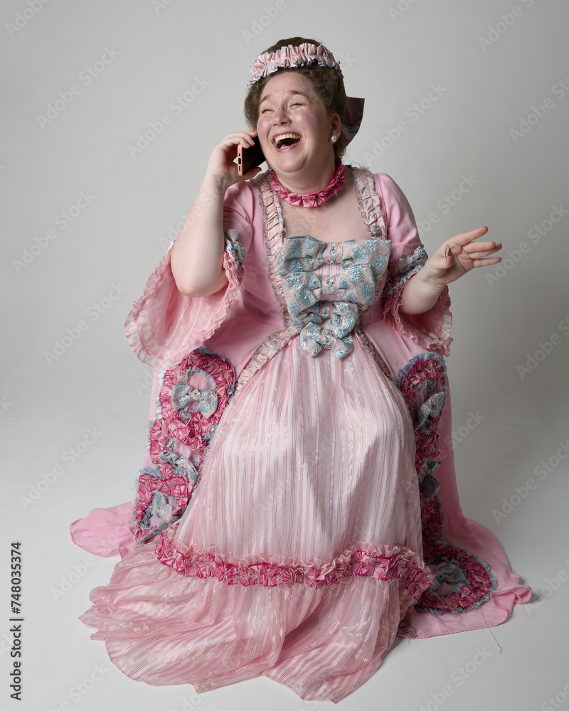 Full length portrait female model wearing opulent pink gown costume of ...