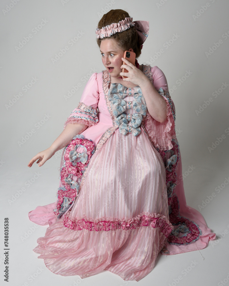 Full length portrait female model wearing opulent pink gown costume of ...