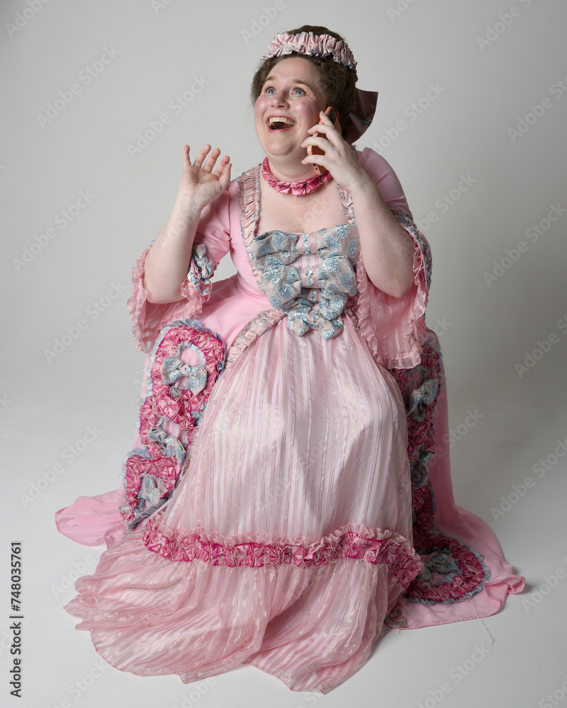 Full length portrait female model wearing opulent pink gown costume of ...
