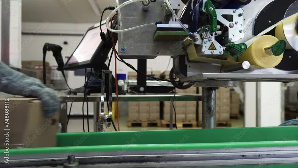 A Close-up of an automated packaging process at Medical Equipment ...