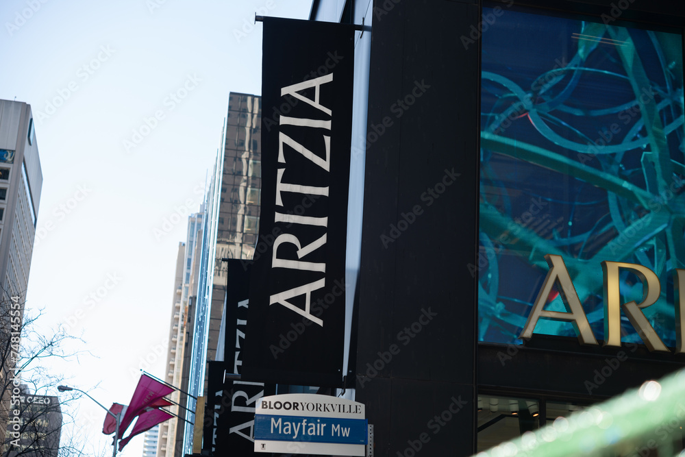 exterior banner signs of Aritzia, a woman's clothing shop, here located ...