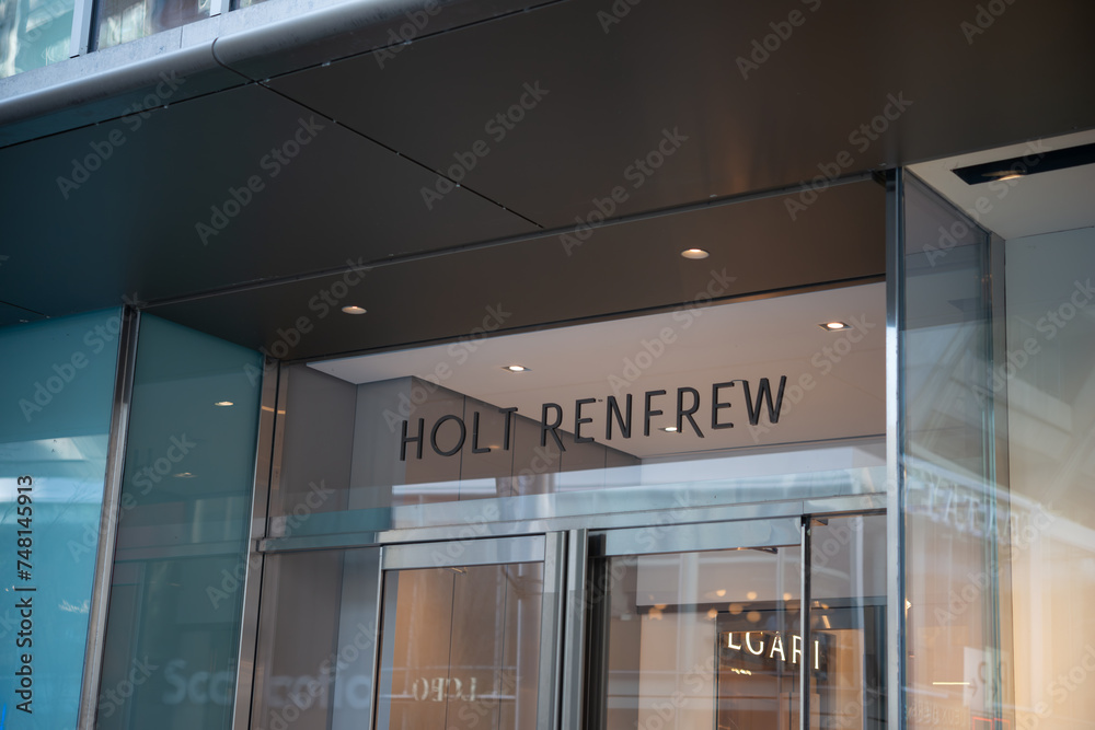 exterior sign over revolving door entrance to Holt Renfrew located at ...