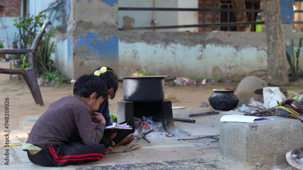 Elementary school students girl and boy doing homework outdoor. Village ...