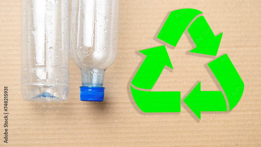 Plastic empty bottles on cardboard background concept of recyclable ...