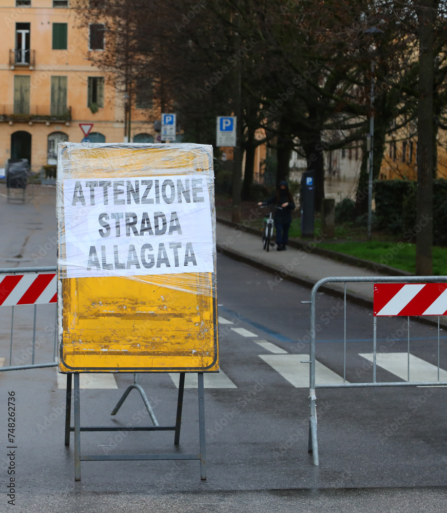 Large warning sign with big text in italian language that means CAUTION ...