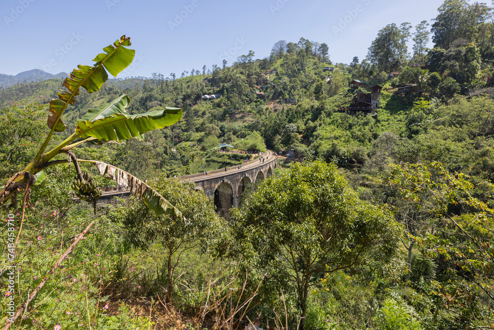 Elevated views of tourists visit Nine Arch Bridge on the railway line ...