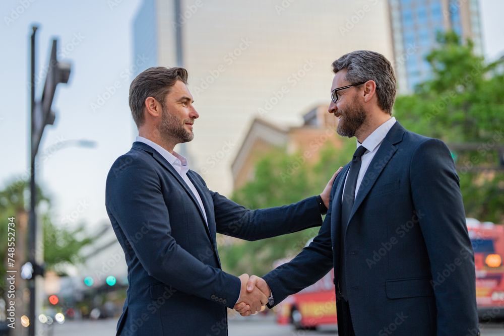 Successful teamwork. Business people shaking hands. Handshake between two business men. Two ...