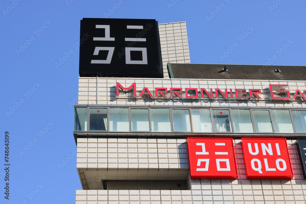 TOKYO, JAPAN - September 30, 2020: Uniqlo signs, including a digital ...