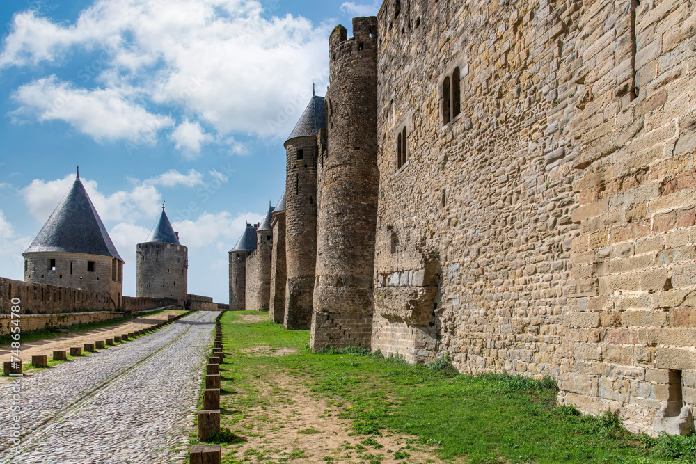 View over length of moat between rows of fortified walls with ...