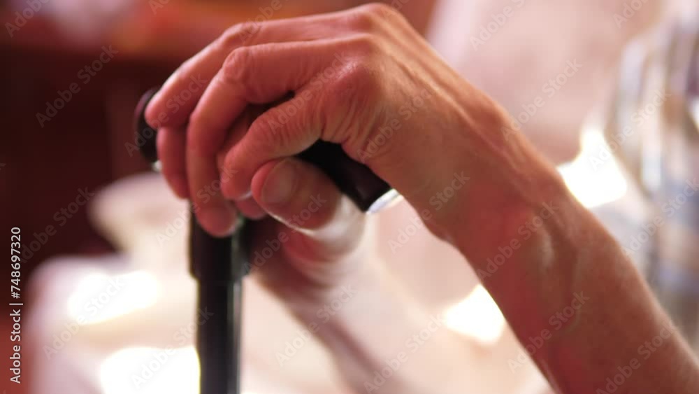 Walking towards wisdom: A close-up of an old man's hands on a cane ...