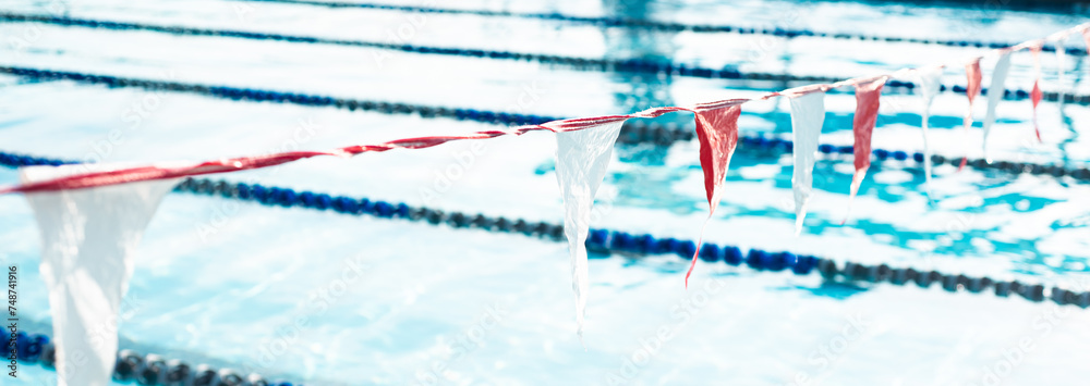 Panorama view public competitive swimming pool near large park, string ...