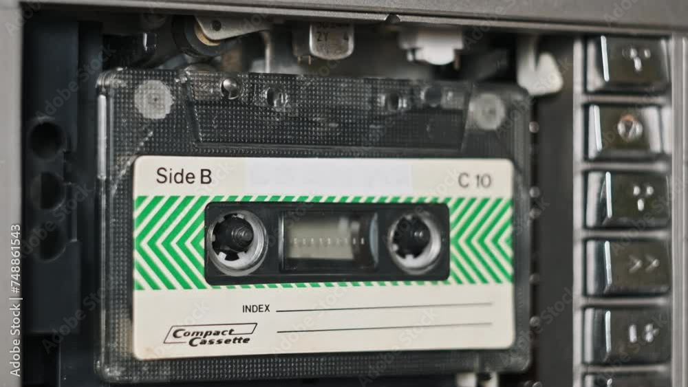 Vidéo Stock Insert an audio cassette in a tape recorder and play, eject ...