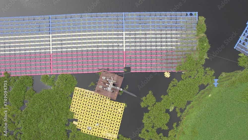 Top aerial view of solar cell panel attach on base over water reservoir ...