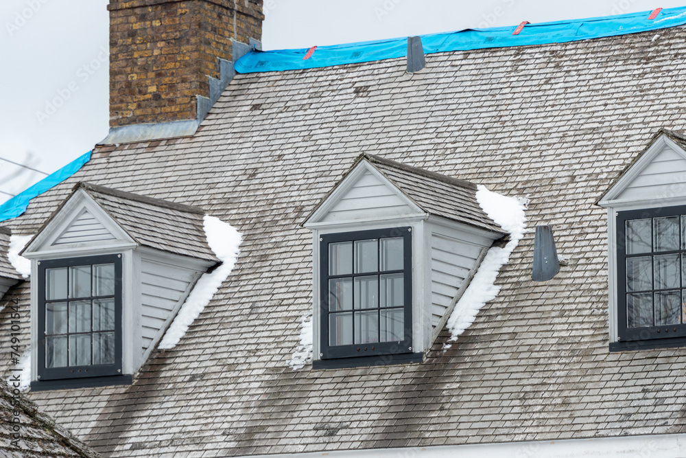 The loft of a large house with three dormer windows, wooden cedar ...