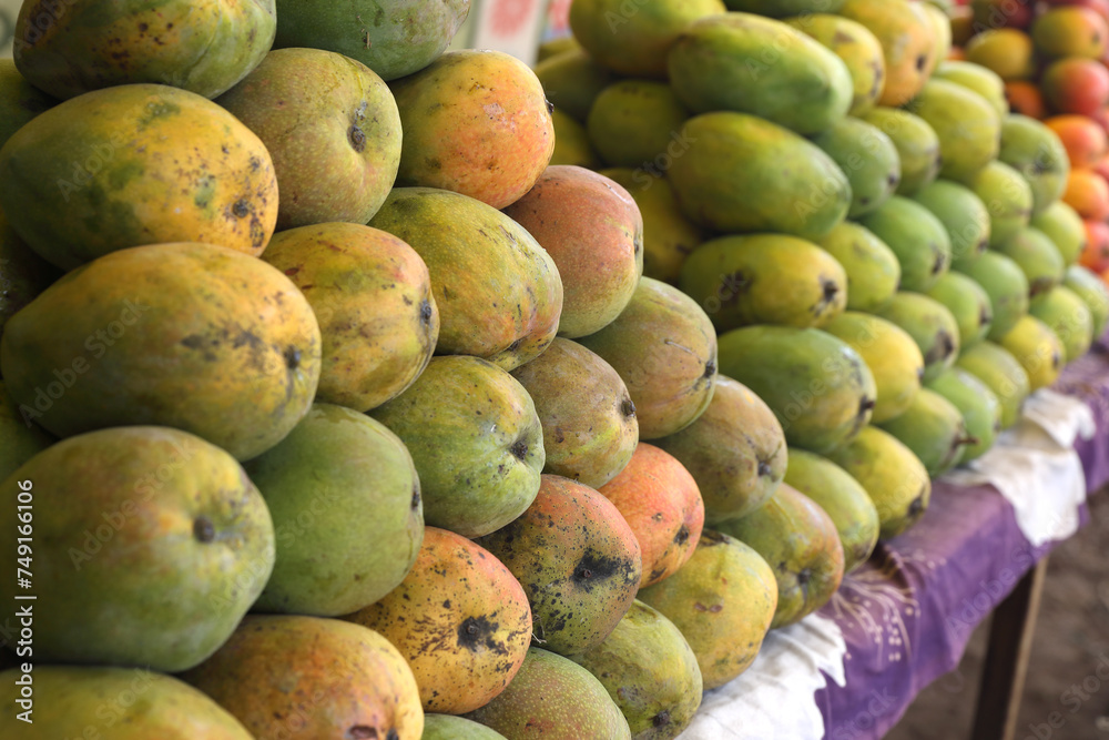 Different types of mangoes at farmer's market Stock Photo | Adobe Stock