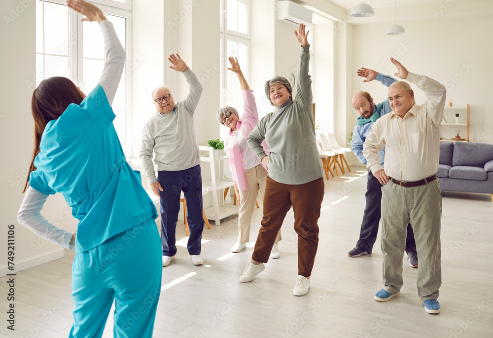 Nurse or physiotherapist doing healthy stretching exercises for ...