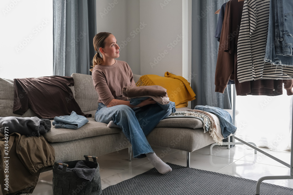 Spring cleaning,second hand,Fast fashion, the girl puts things in order ...