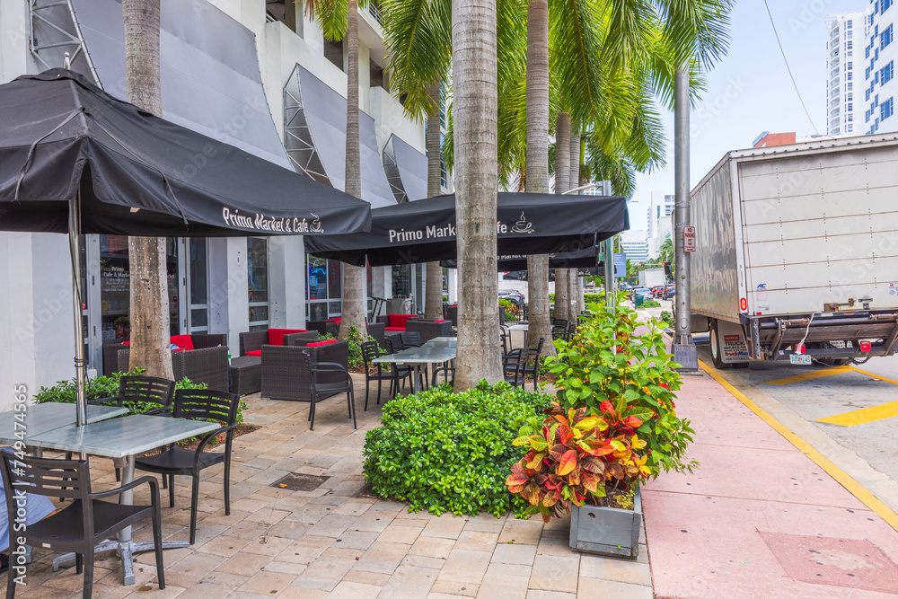 City restaurant exterior on Collins Avenue featuring elegantly set ...