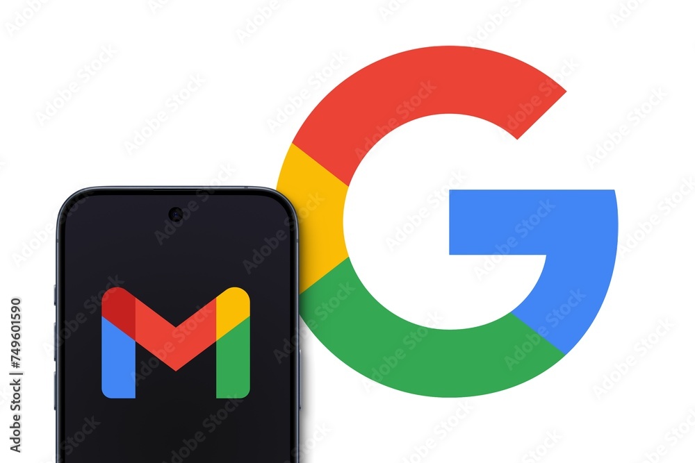Gmail logo is displayed on a modern smartphone, big Google logo in the background, email service ...