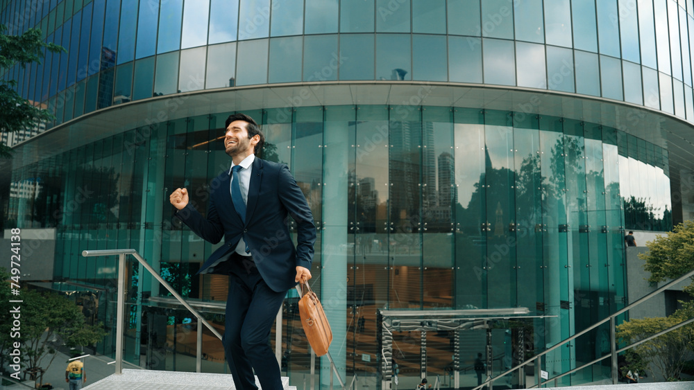Dancing business man walking and hold bag while dancing at park. Happy ...