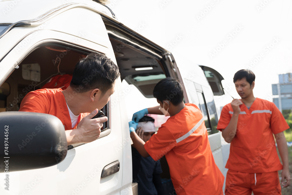 Injured man broken head and bandage. Ambulance staff member assisting ...