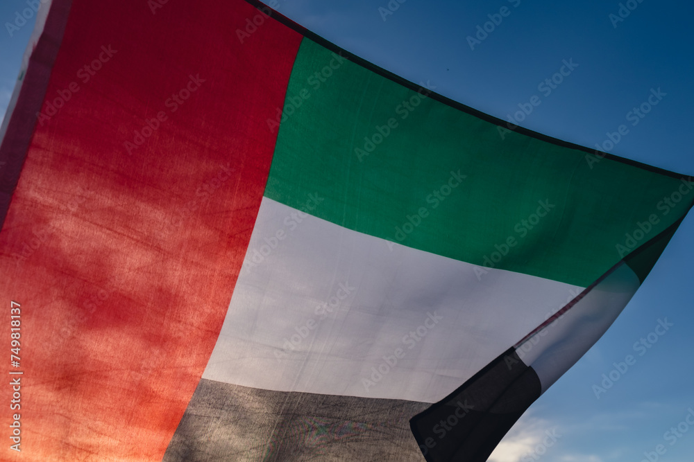 National Flag Of UAE Waving In The Wind sunset. Flag of United Arab ...