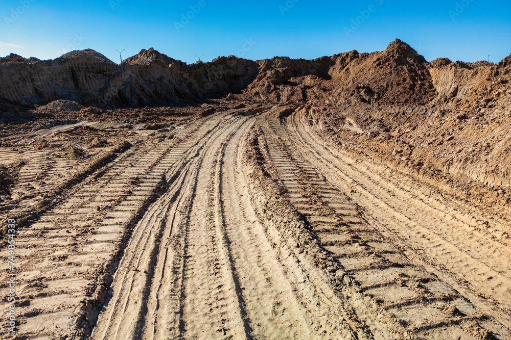 Open sand pit, for sand extraction during construction. The texture of ...