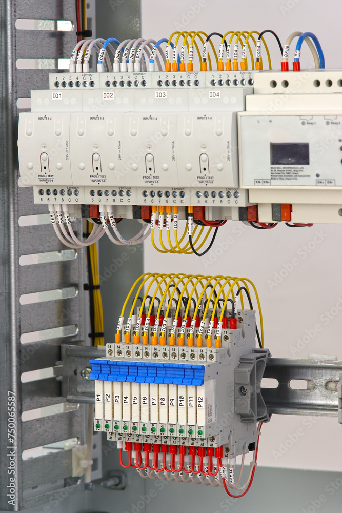 Electronic control modules for apartment automation are installed in an ...