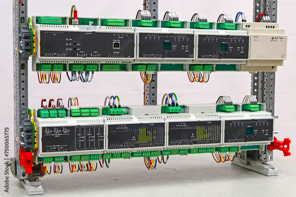 Electronic control modules for apartment automation are installed in an ...