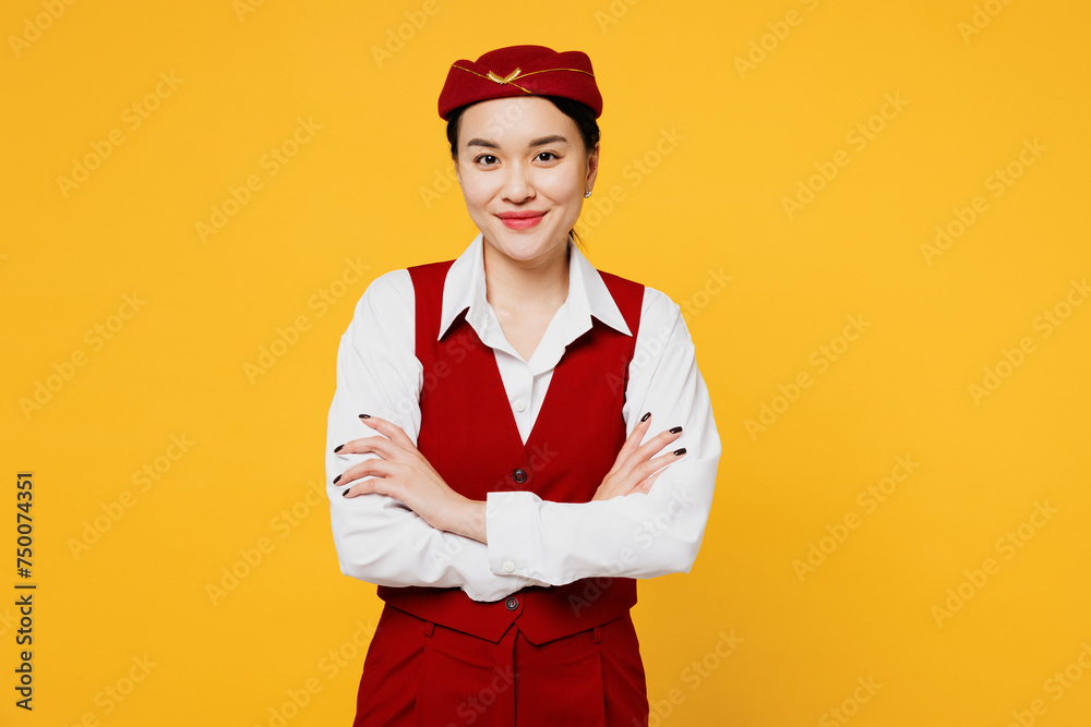 Young stewardess flight attendant woman of Asian ethnicity she wears ...