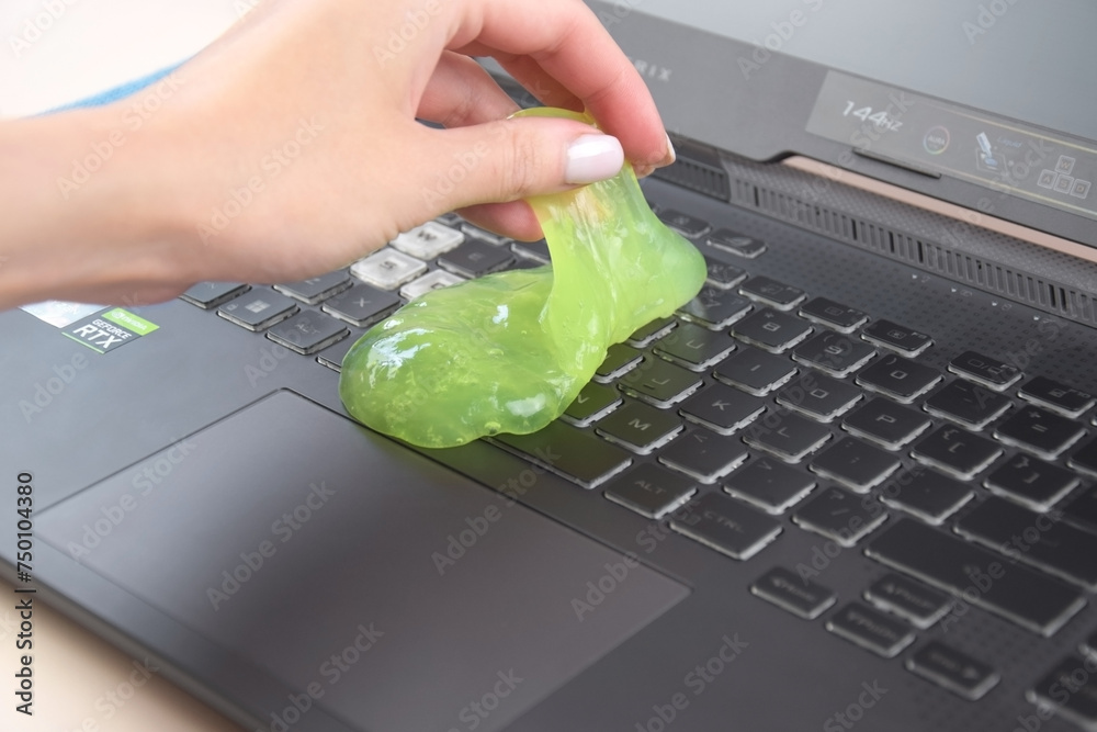 Green soft cleaning gel for cleaning dust on a laptop keyboard Asus Rog ...