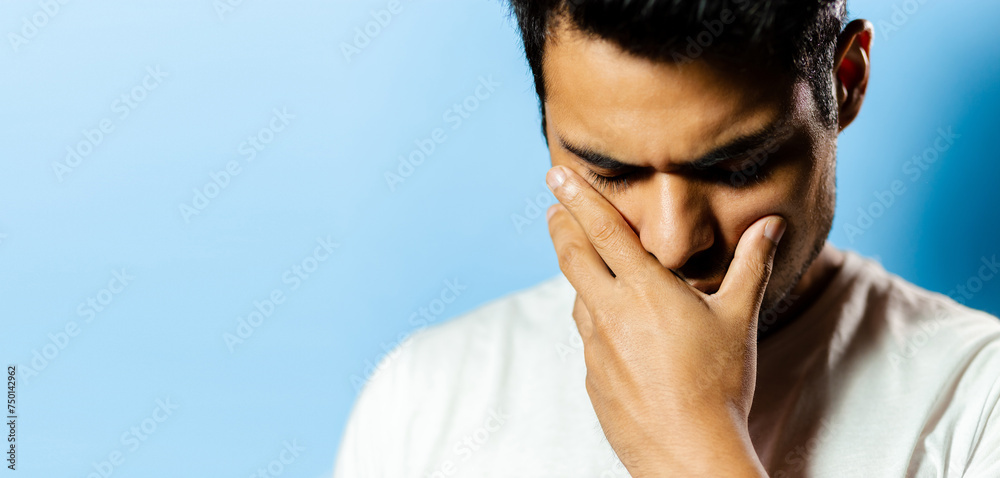 A young person with an expression of pain, sadness, apathy, and stress ...