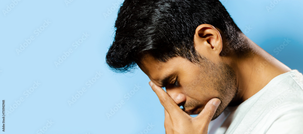 A young person with an expression of pain, sadness, apathy, and stress ...